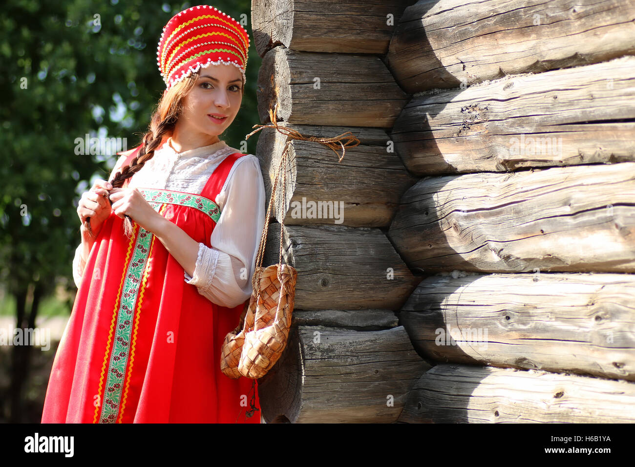 girl traditional dress log Stock Photo - Alamy