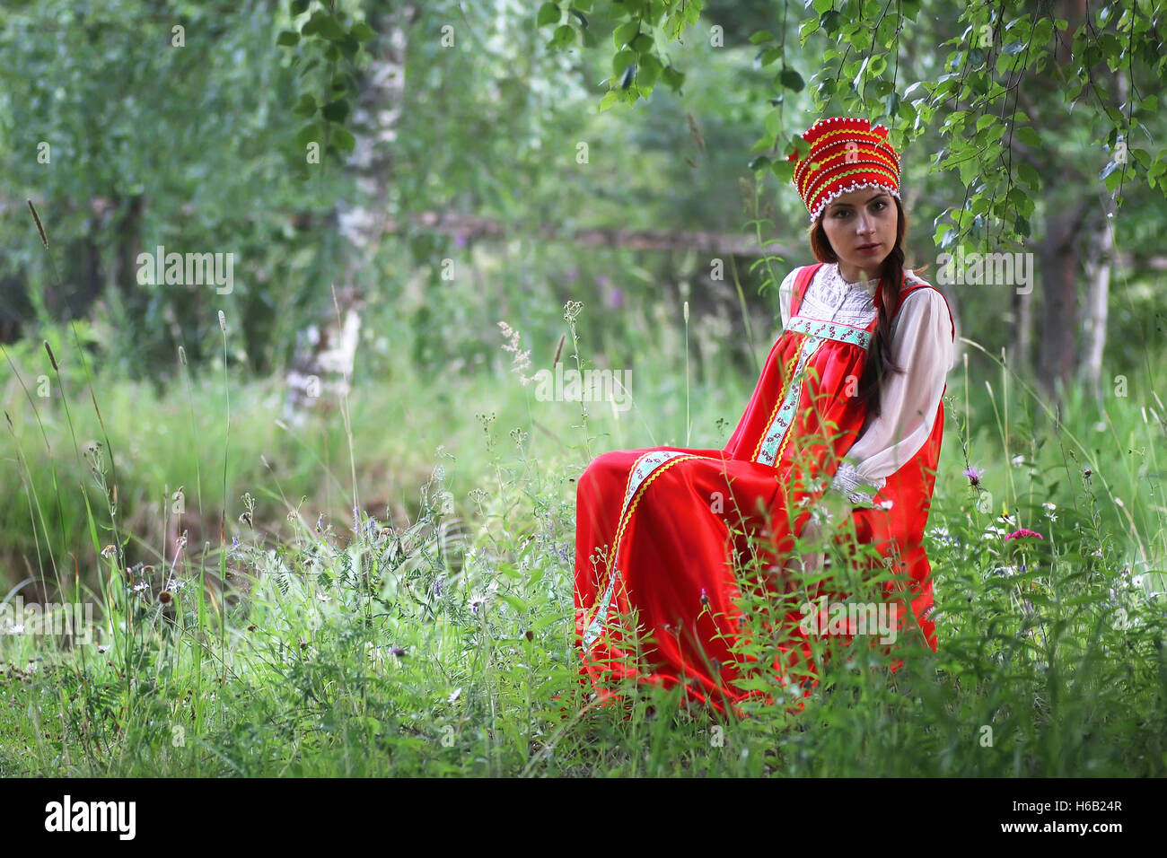 Slav in traditional dress is sitting in nature Stock Photo - Alamy