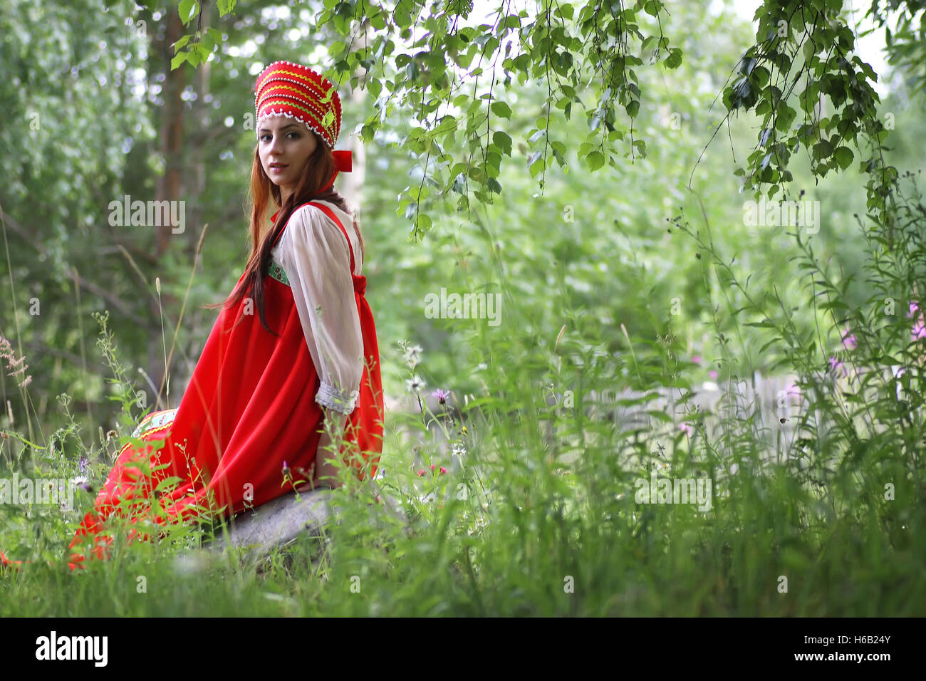 Slav in traditional dress is sitting in nature Stock Photo - Alamy