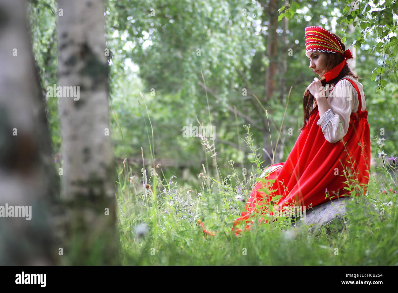 Slav in traditional dress is sitting in nature Stock Photo - Alamy