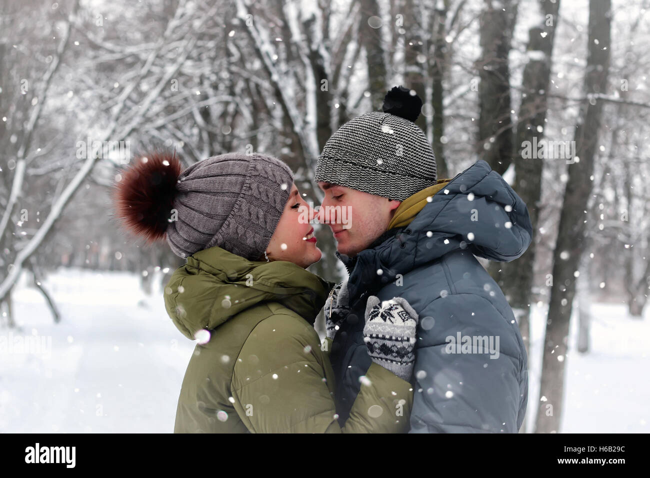 couple lovers kiss winter street Stock Photo - Alamy