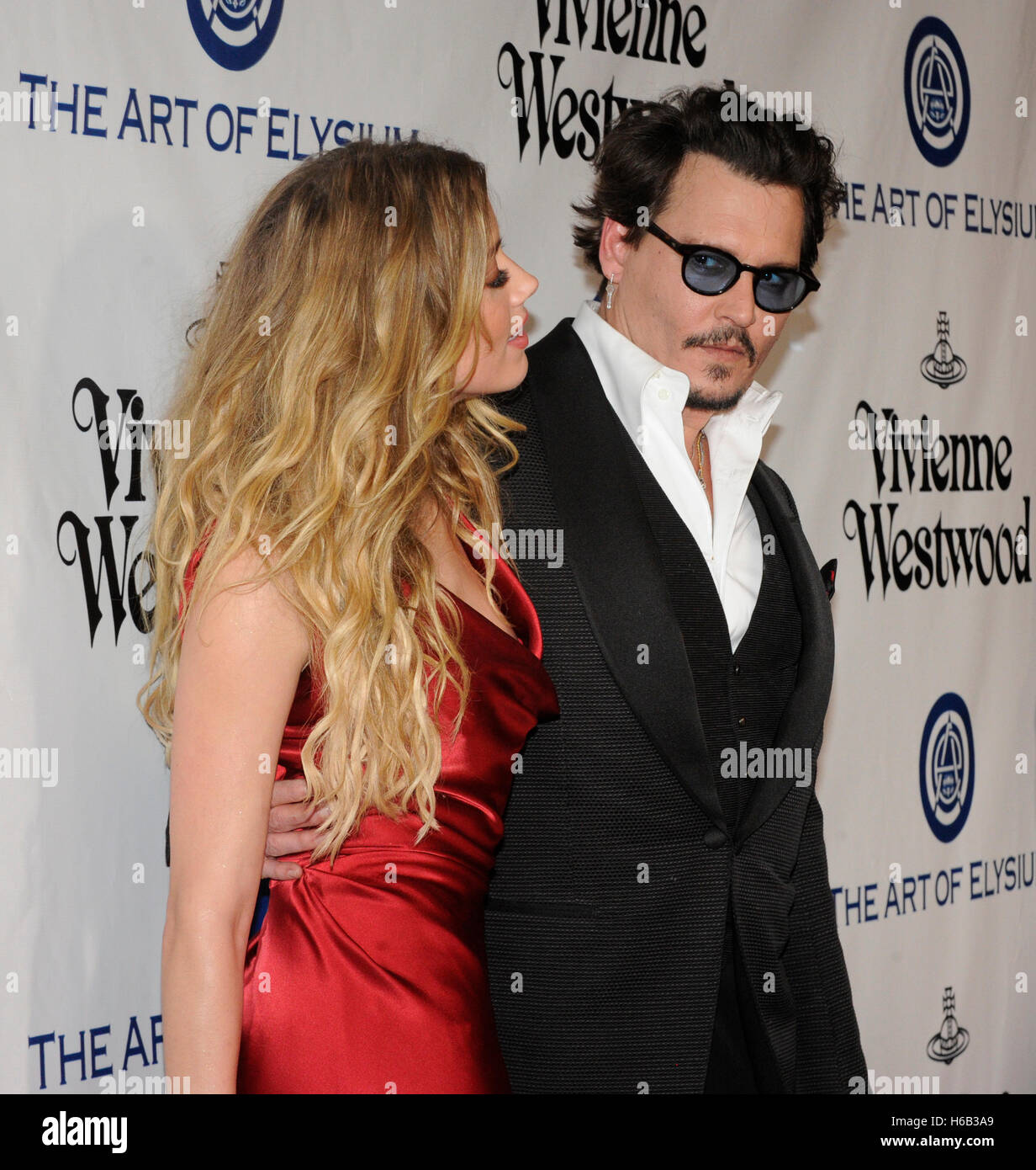 Actors Amber Heard (L) and Johnny Depp attend The Art of Elysium 2016 ...