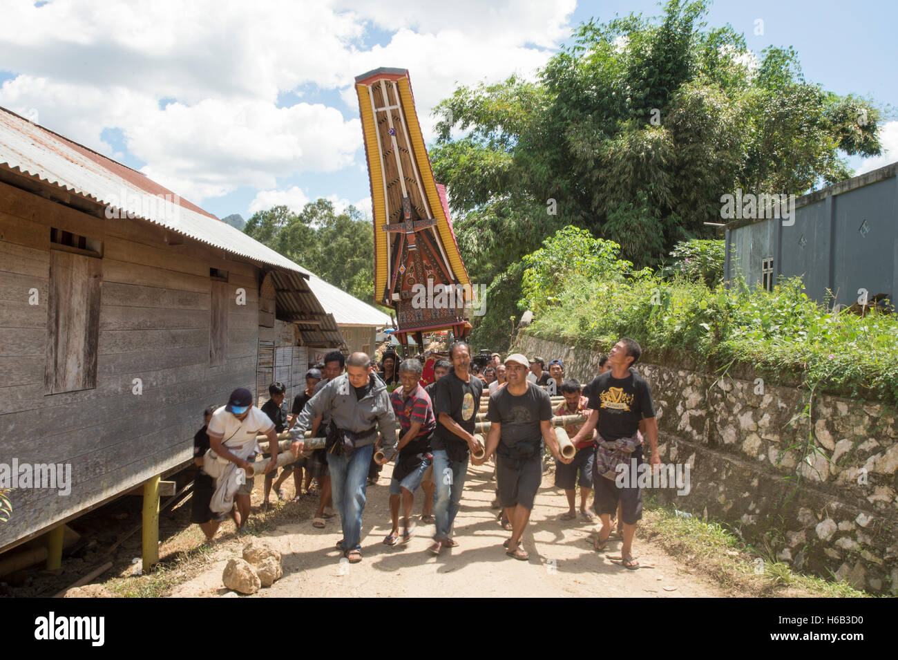 Family and relatives parade the coffin to the special burial site ...