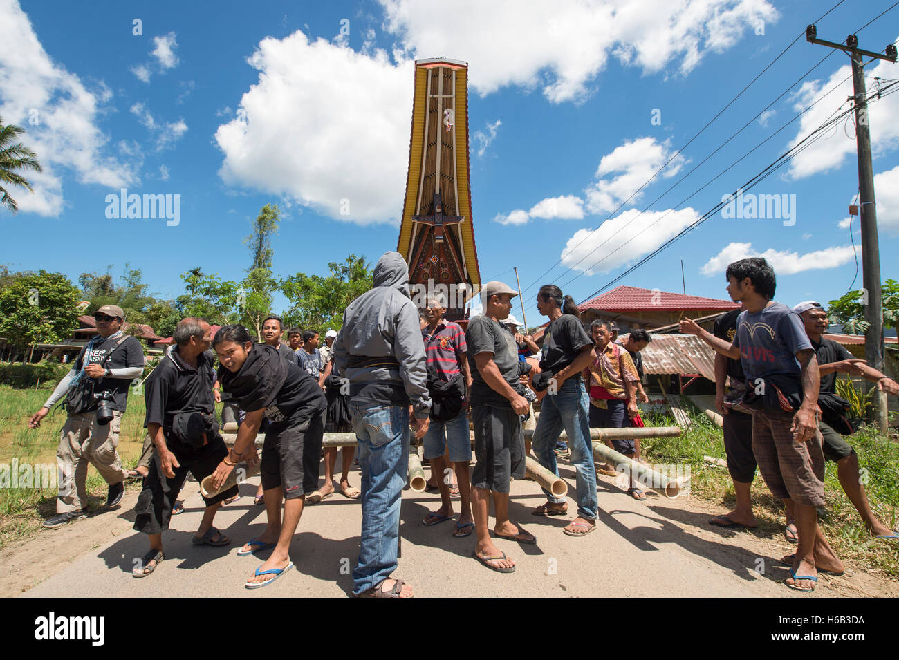 Family and relatives parade the coffin to the special burial site ...