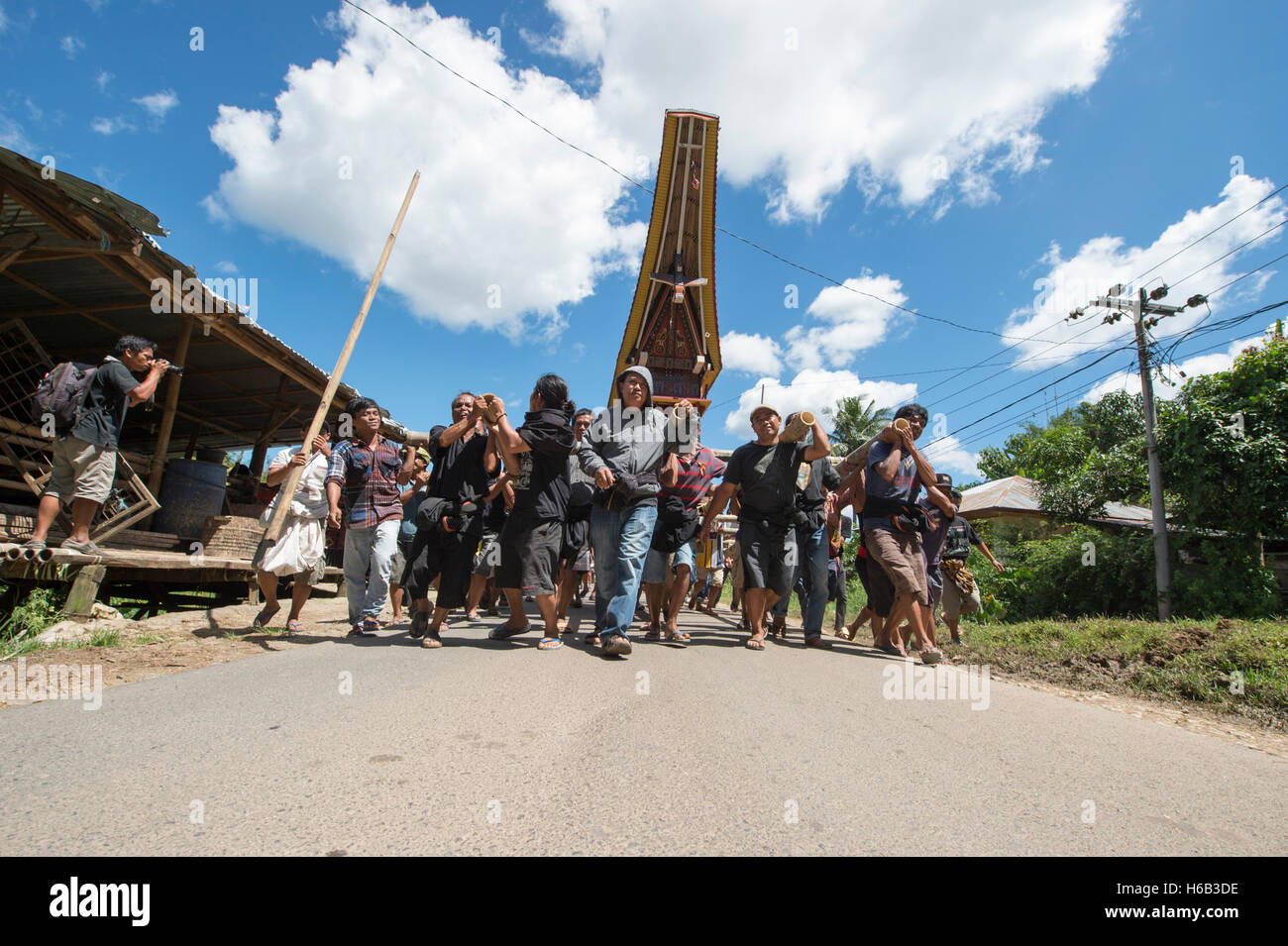 Family and relatives parade the coffin to the special burial site ...