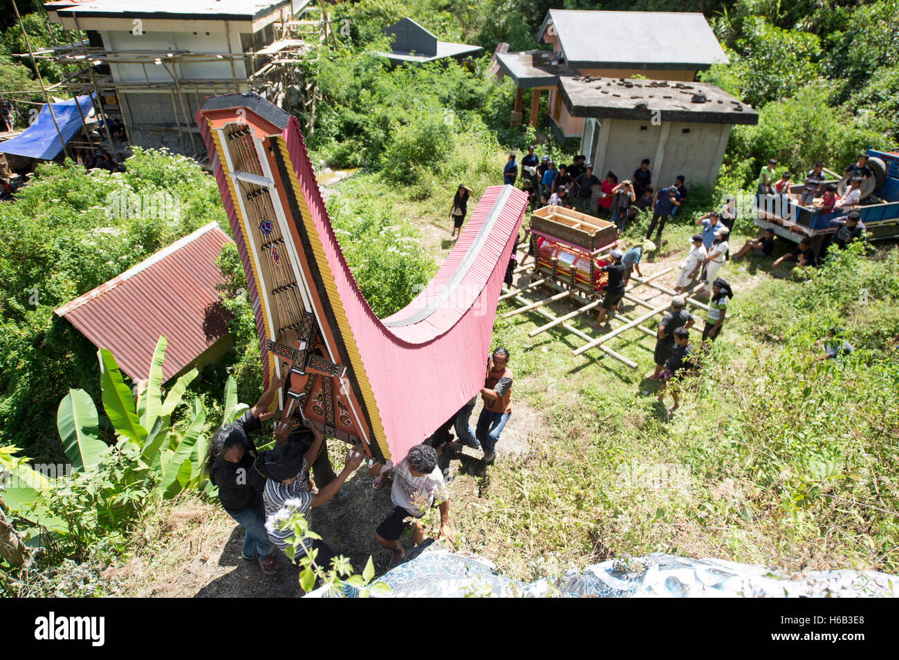 Family and relatives parade the coffin to the special burial site ...