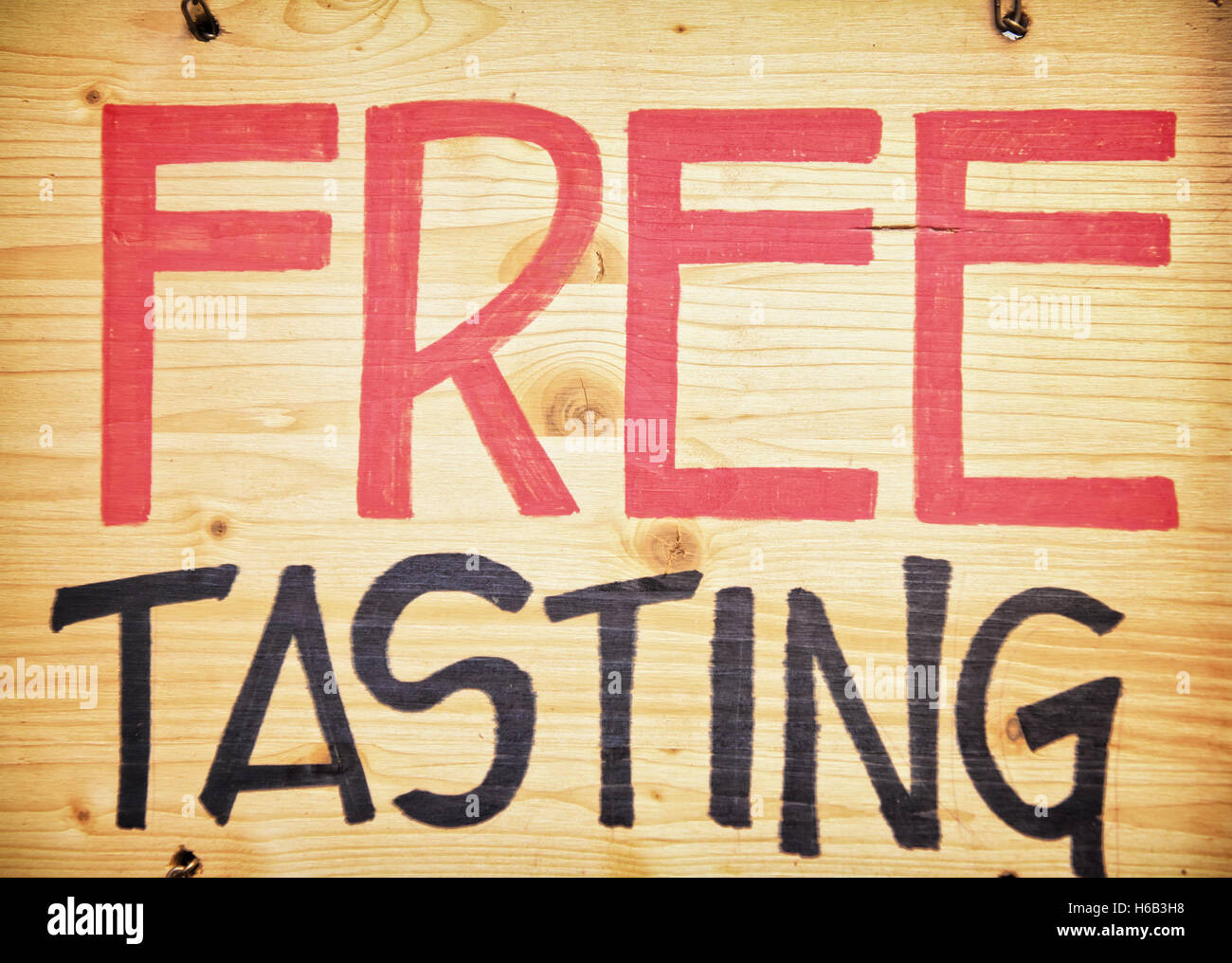 Wooden sign for free tasting closeup Stock Photo - Alamy