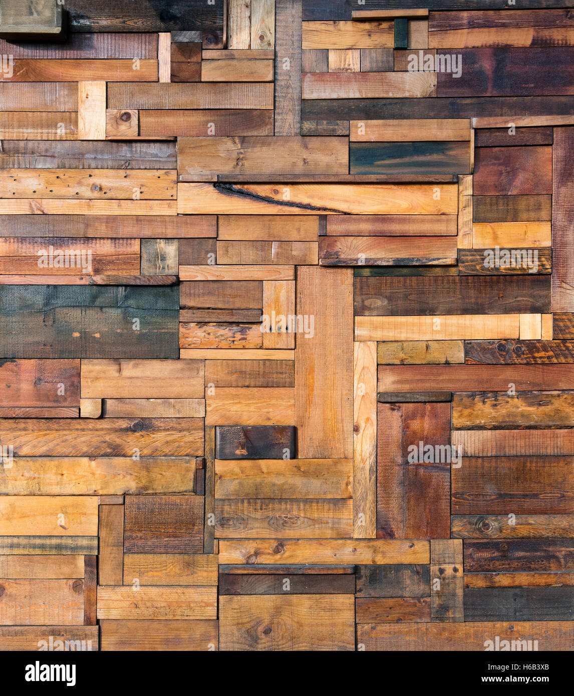 Tightly fitted full frame of stained and cured wooden blocks as ...