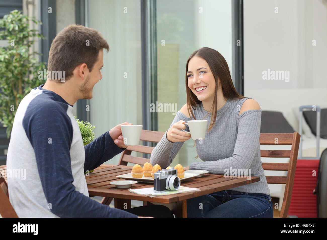 Roommates talking in a hostel room hi-res stock photography and images ...
