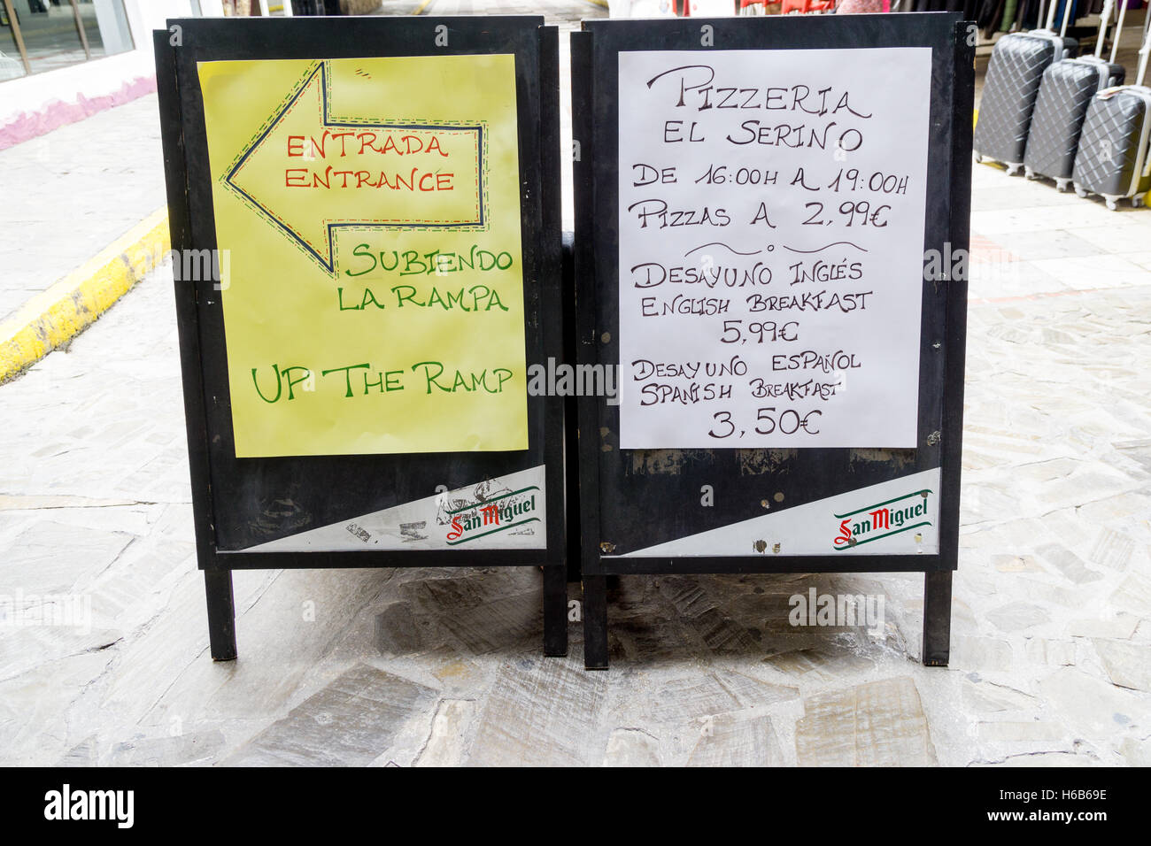 Two bi-lingual hand written signs in Spanish and English Stock Photo ...