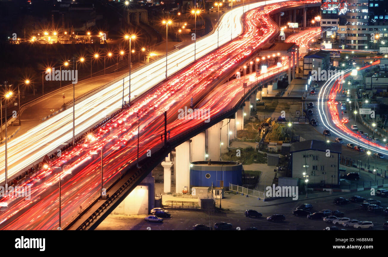 Traffic jam on automobile overpass at night, view from above. light ...