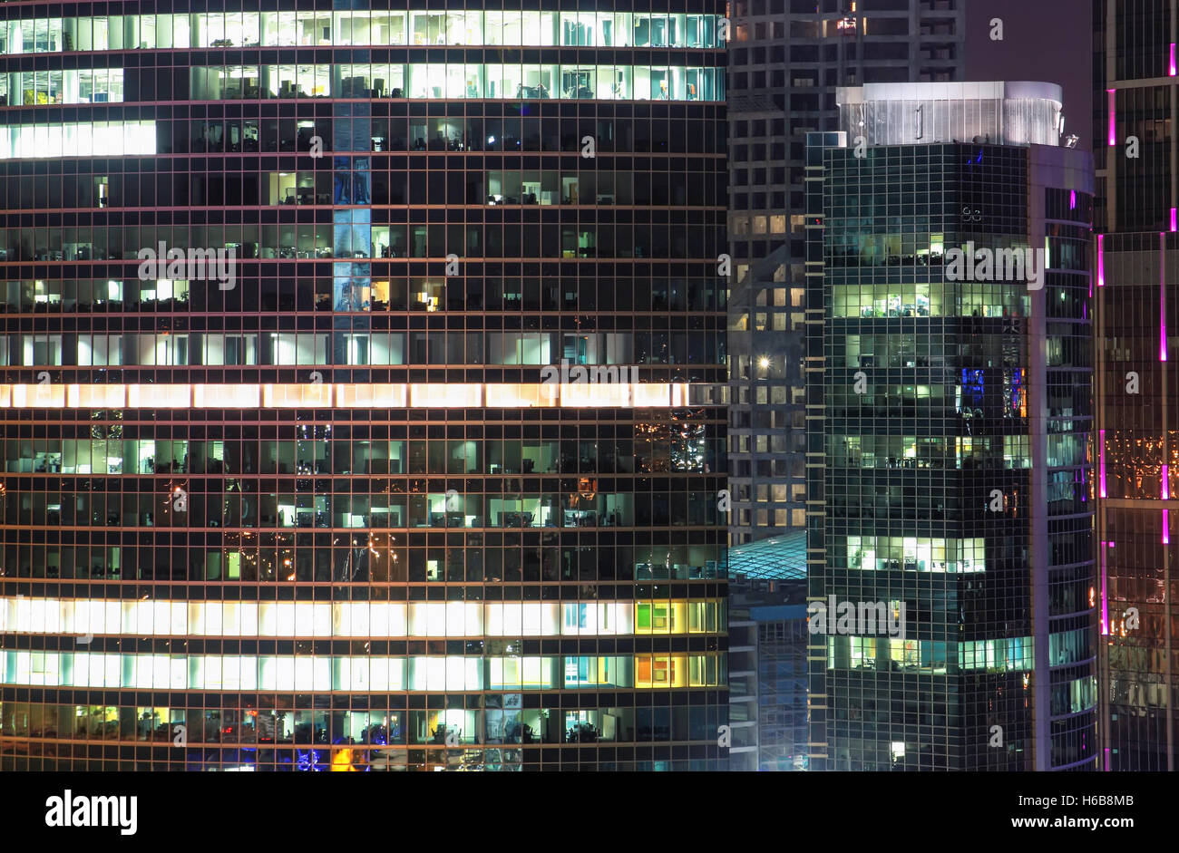 Windows office building for background at night Stock Photo - Alamy