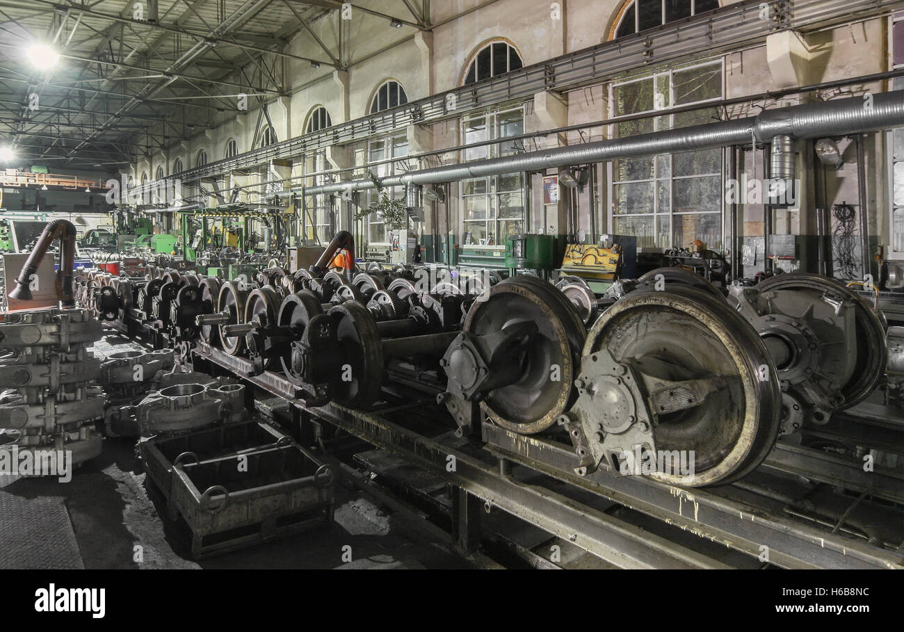 Wheel shop vehicle repair station. Many old wheel-set standing on rail ...