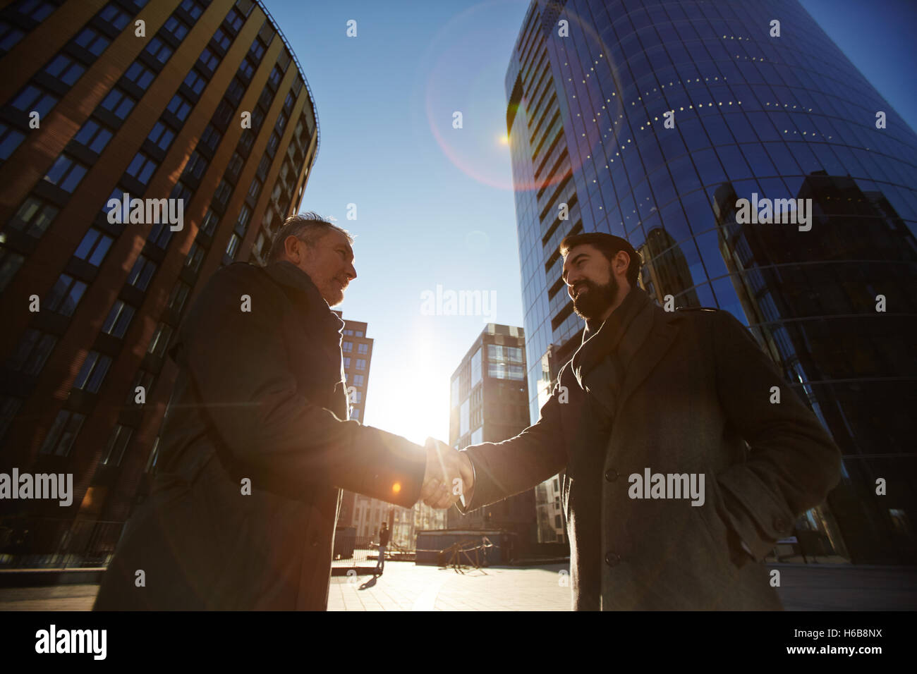 Businesspeople greeting partner hi-res stock photography and images - Alamy