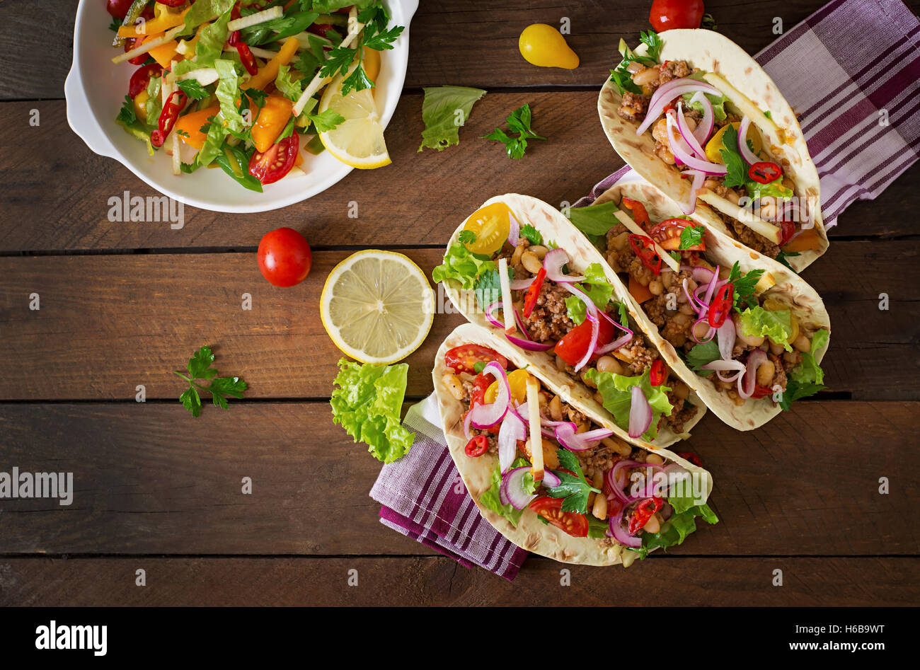 Mexican tacos with meat, beans and salsa. Top view Stock Photo - Alamy