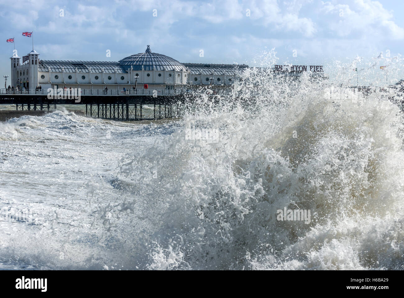 Waves crashing onto Brighton seafront Stock Photo - Alamy