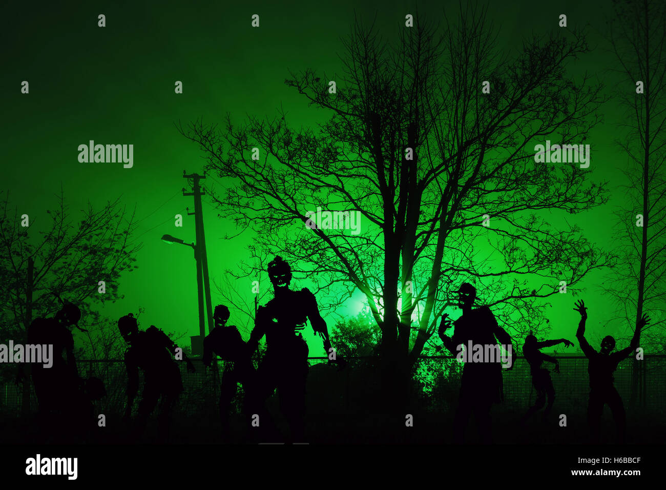 crowd of hungry zombies near residential buildings. Silhouettes of ...