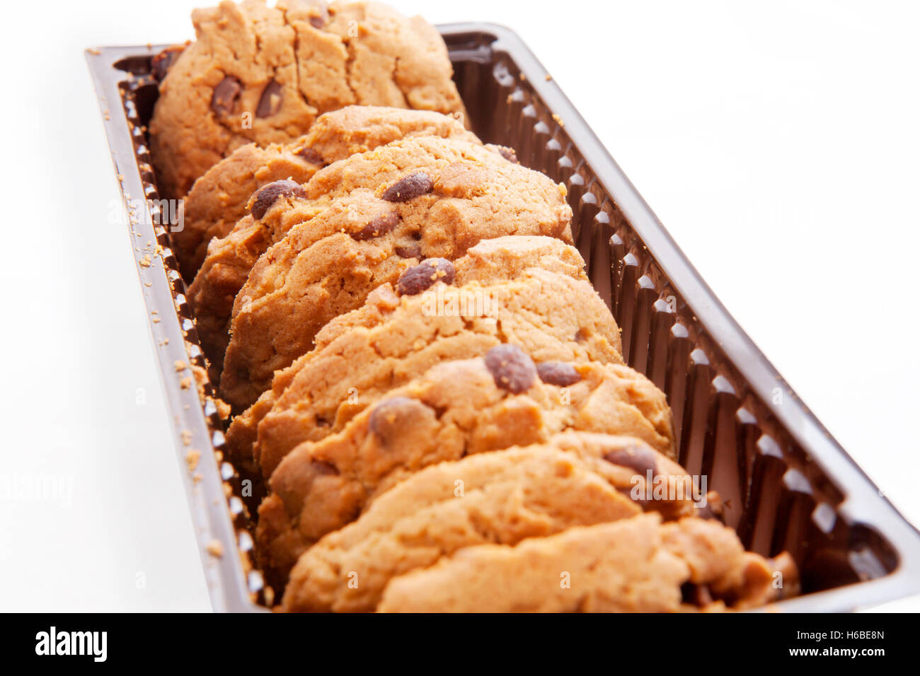 Plastic box filled with cookies isolated Stock Photo - Alamy