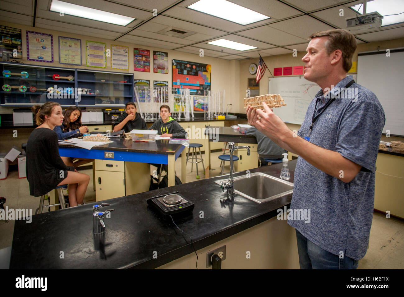 A high school teacher in Mission Viejo, CA, shows a student-made ...