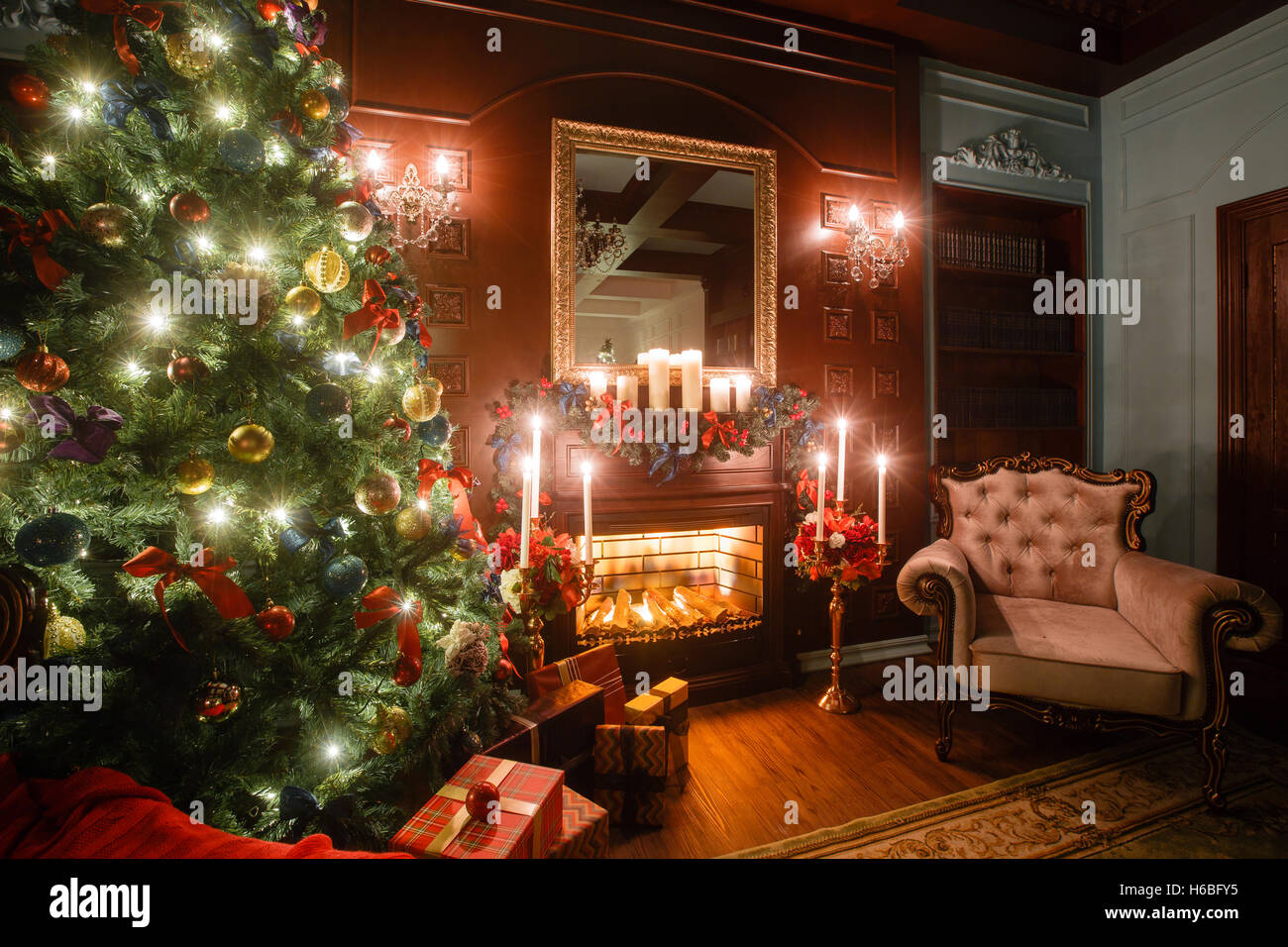 Christmas evening by candlelight. classic apartments with a white ...
