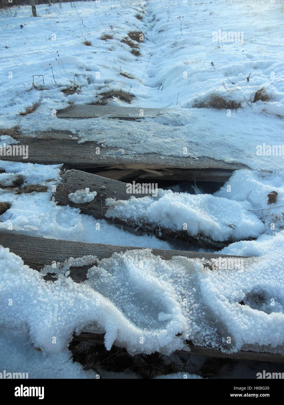 Frozen snow on the ground Stock Photo - Alamy