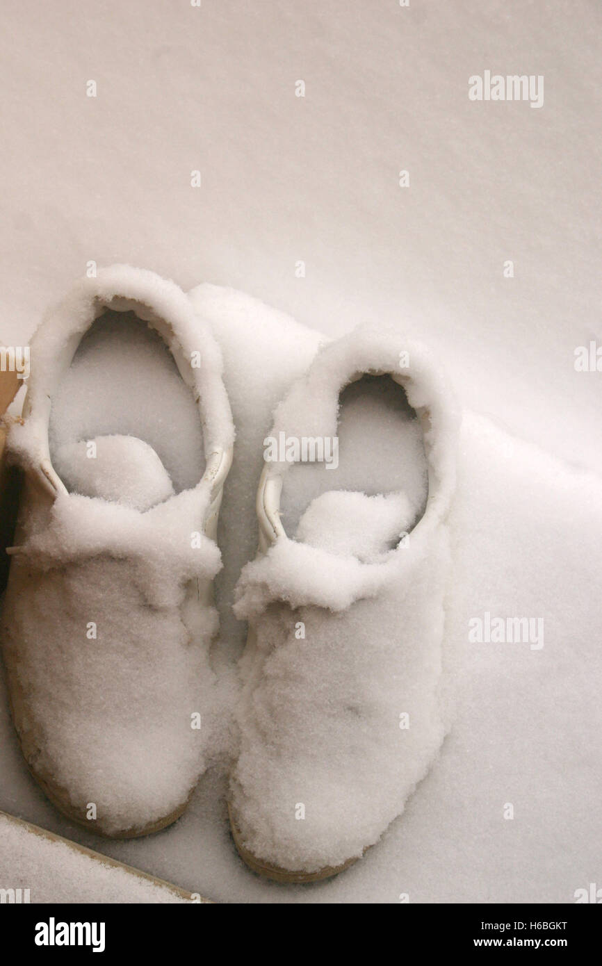 Snow on shoes left outside Stock Photo - Alamy