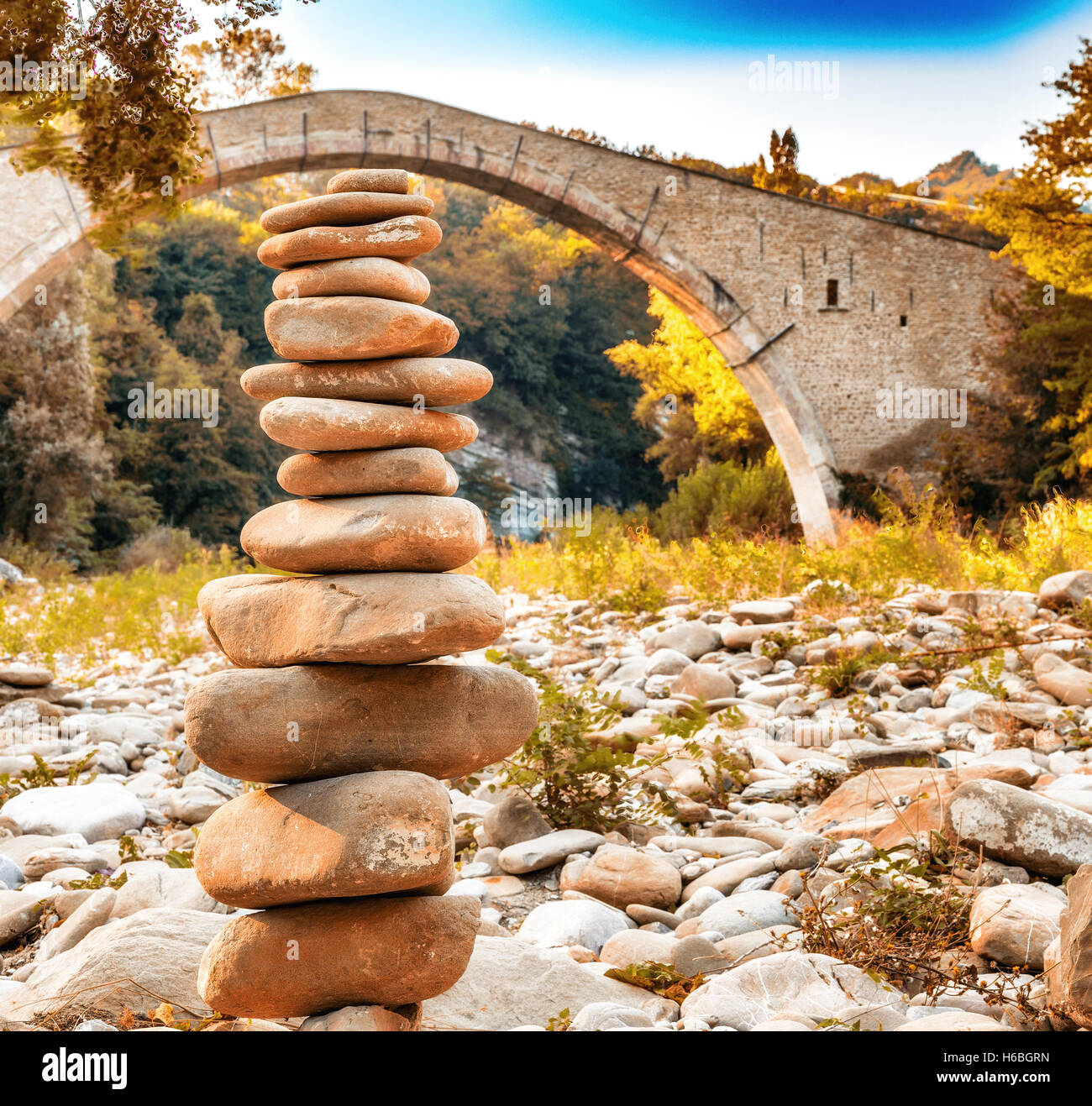 pile of stones in front of 500 years old hunchback Renaissance bridge ...