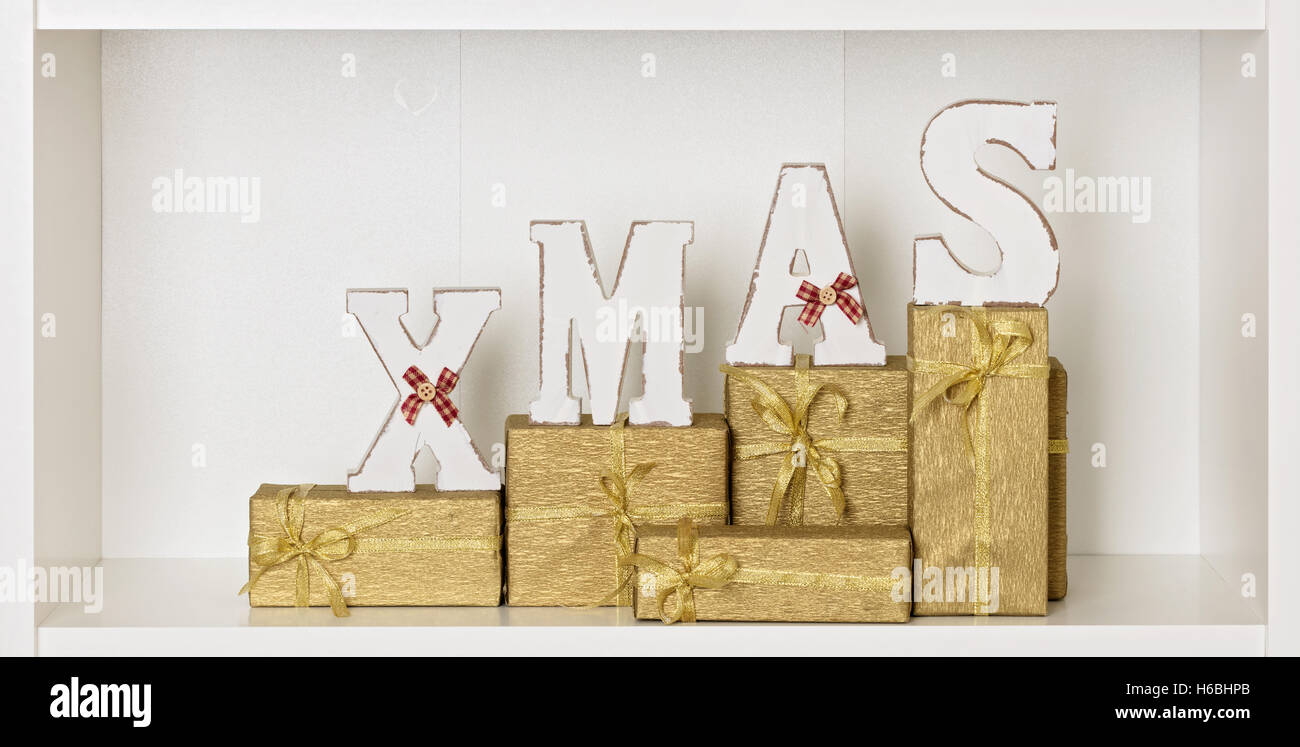 Wooden white XMAS letters on a white background with Packed gifts Stock ...