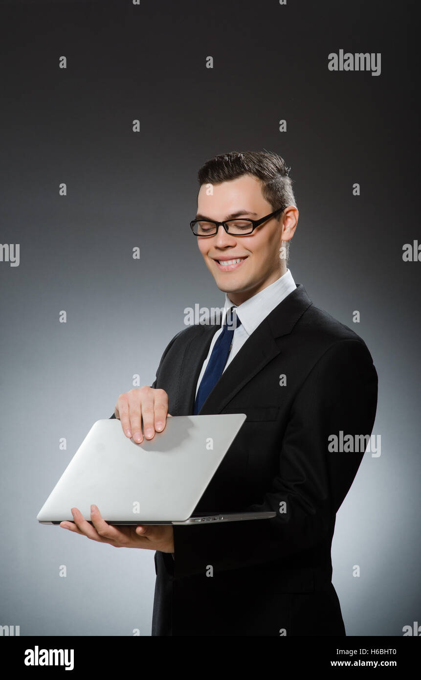 Man with laptop in business concept Stock Photo - Alamy