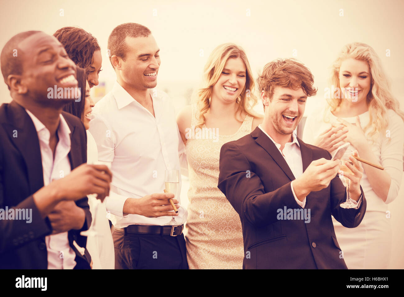 Well dressed people looking smartphone Stock Photo - Alamy