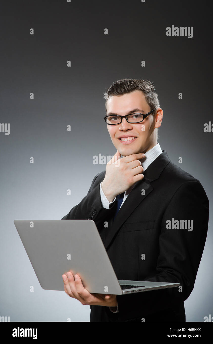 Man with laptop in business concept Stock Photo - Alamy