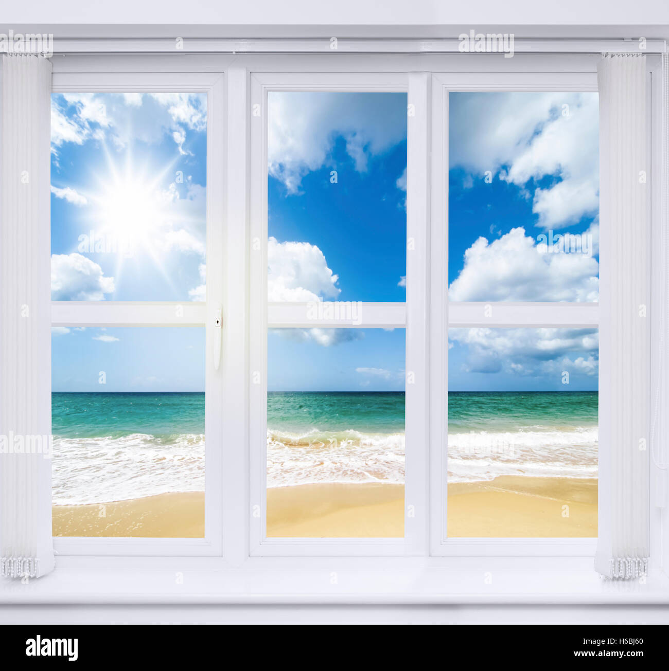 Beach house window overlooking an ocean view Stock Photo - Alamy