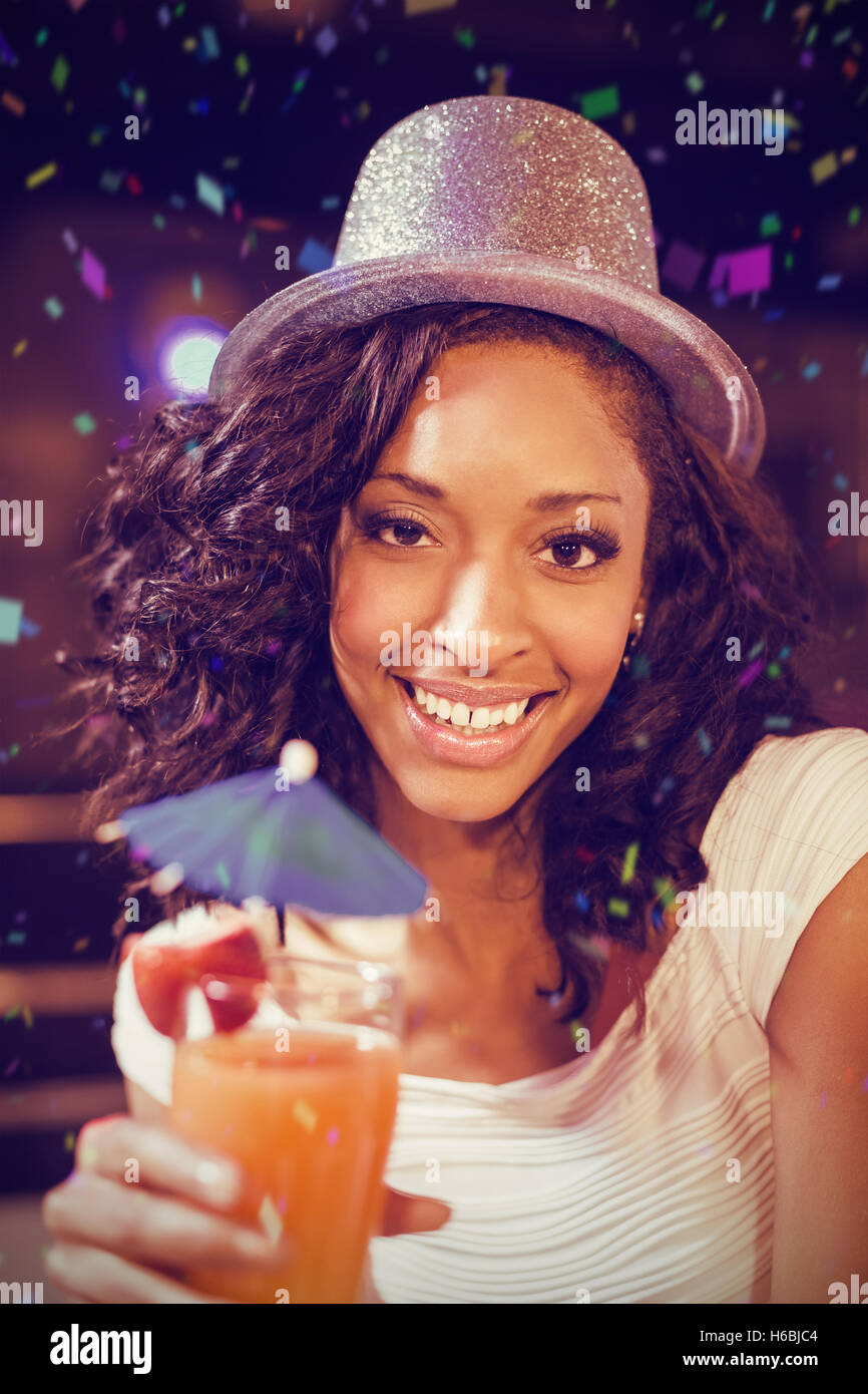 Composite image of pretty girl with cocktail and glitter hat Stock ...