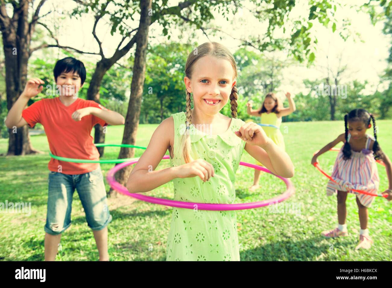Girls boys hula hoop hi-res stock photography and images - Alamy