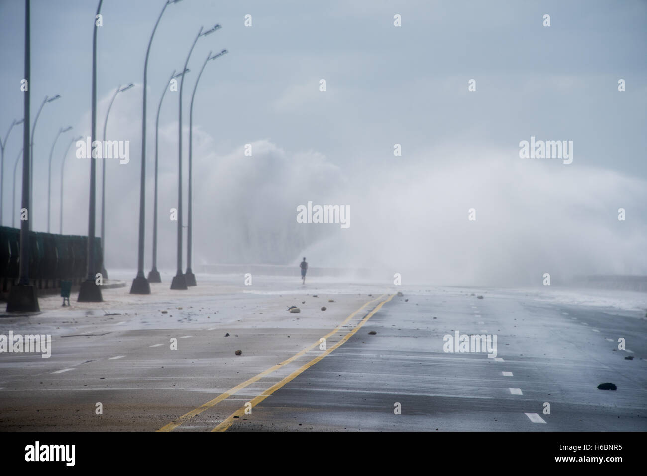 Man running in waves hi-res stock photography and images - Alamy