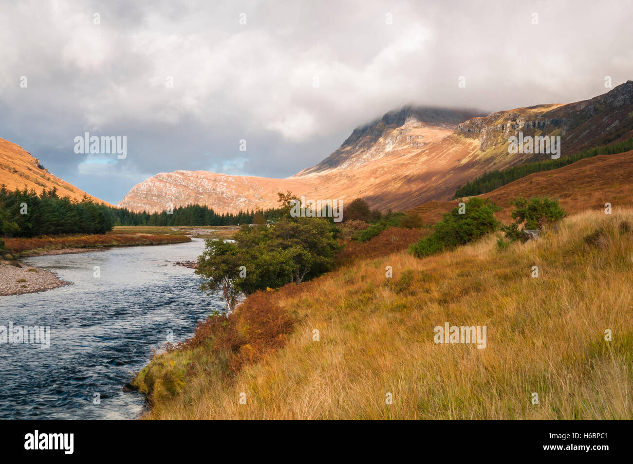 A landscape image looking at Ben Hope along the Strathmore river ...