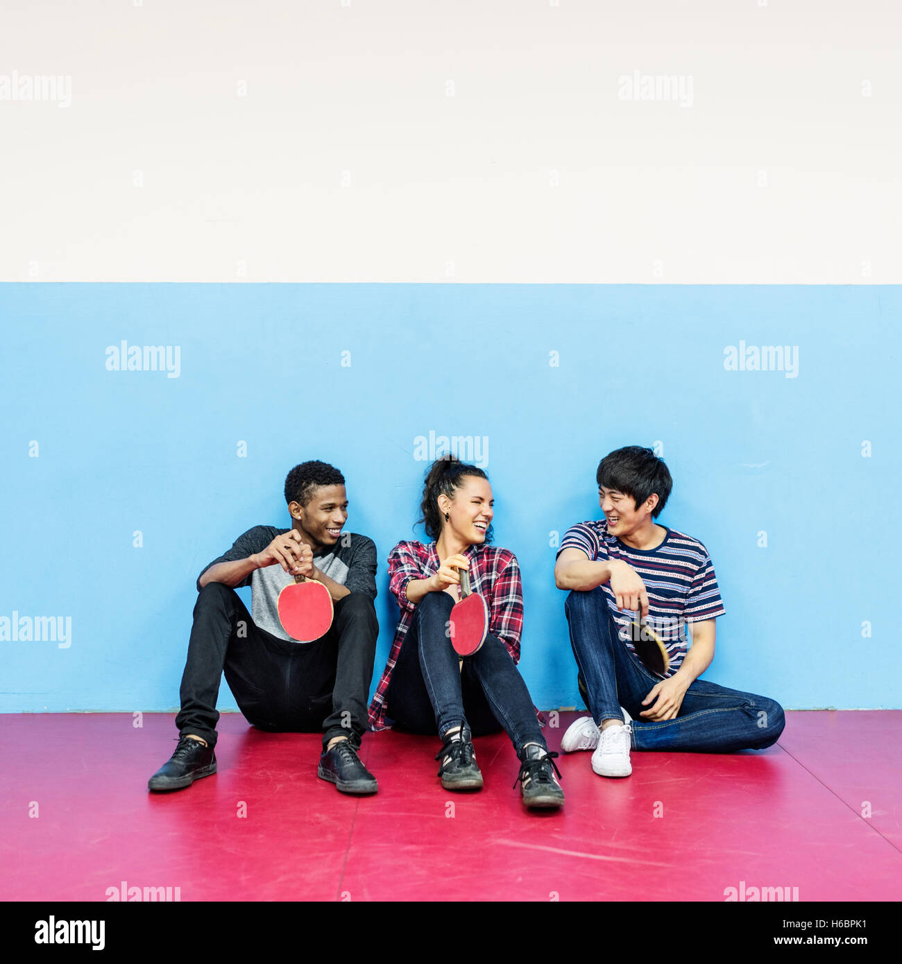 Diverse friends playing tennis hi-res stock photography and images - Alamy