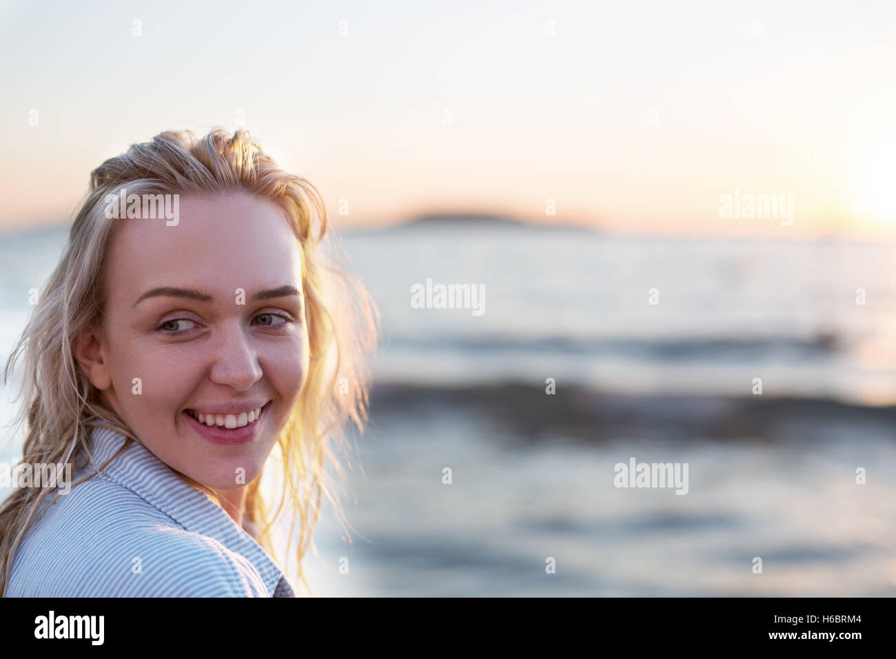 Beautiful female model having fun on the beach Stock Photo - Alamy