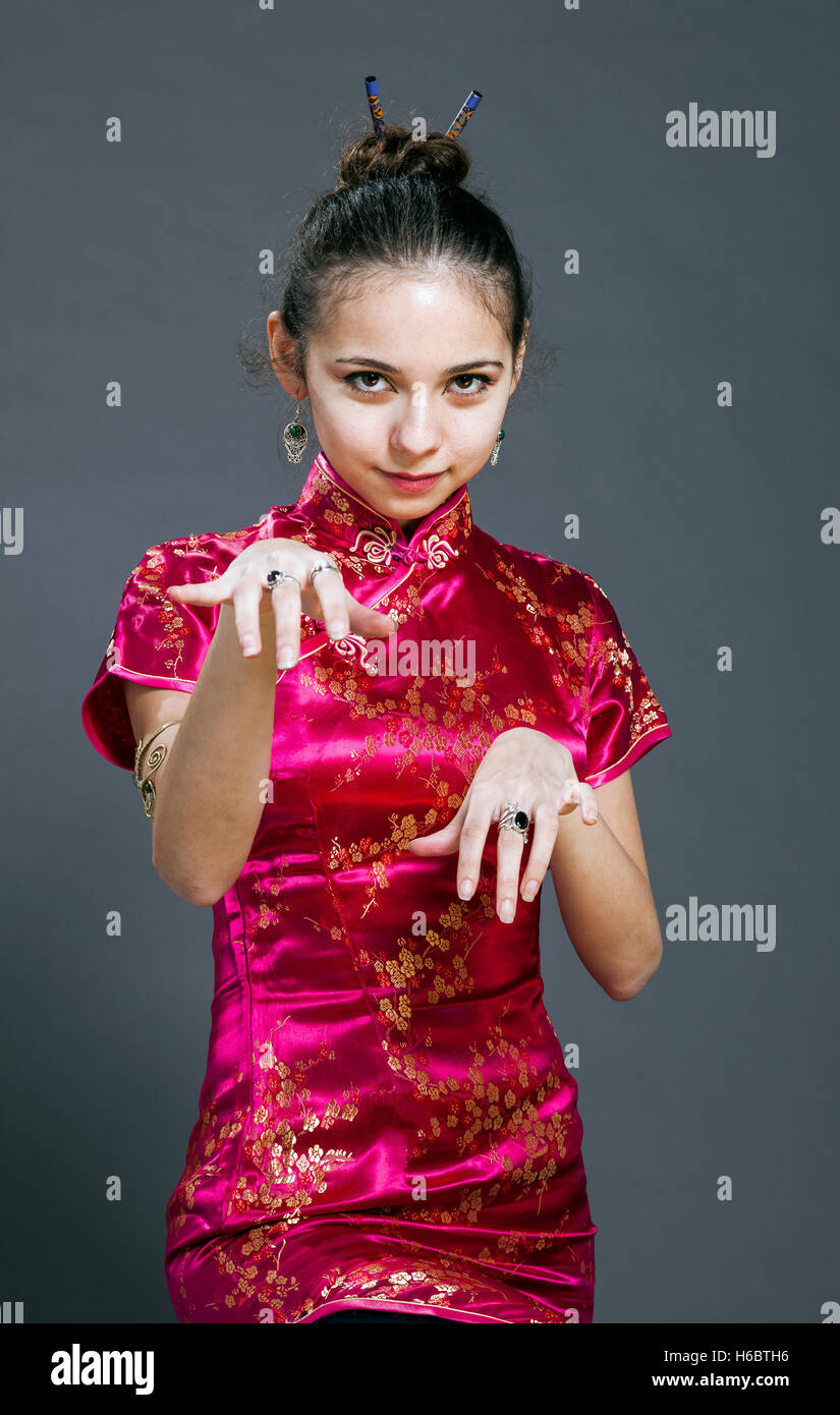 Studio shot of a woman in her early twenties, wearing traditional ...