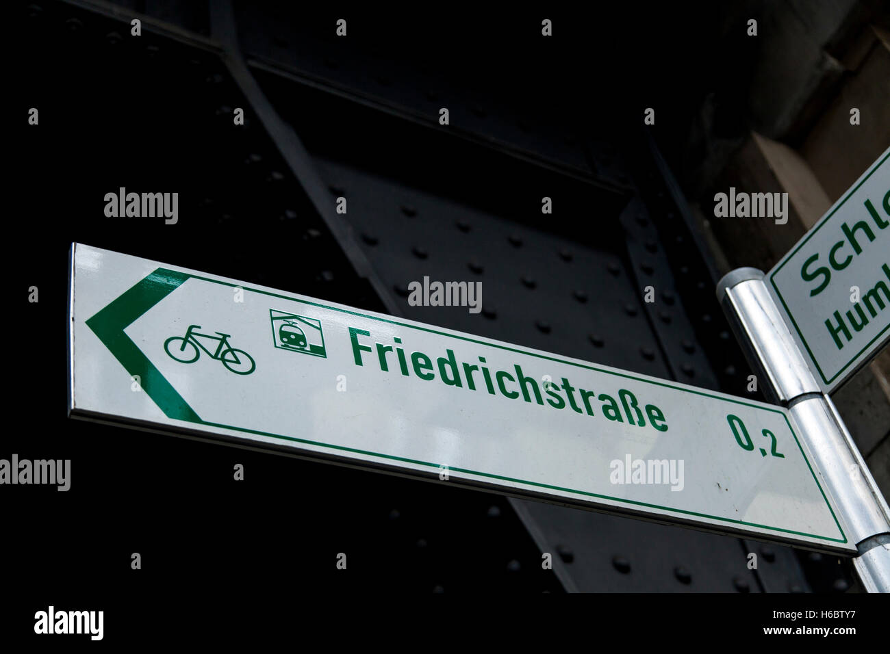 Street sign depicting the direction and distance to Friedrichstrasse in ...