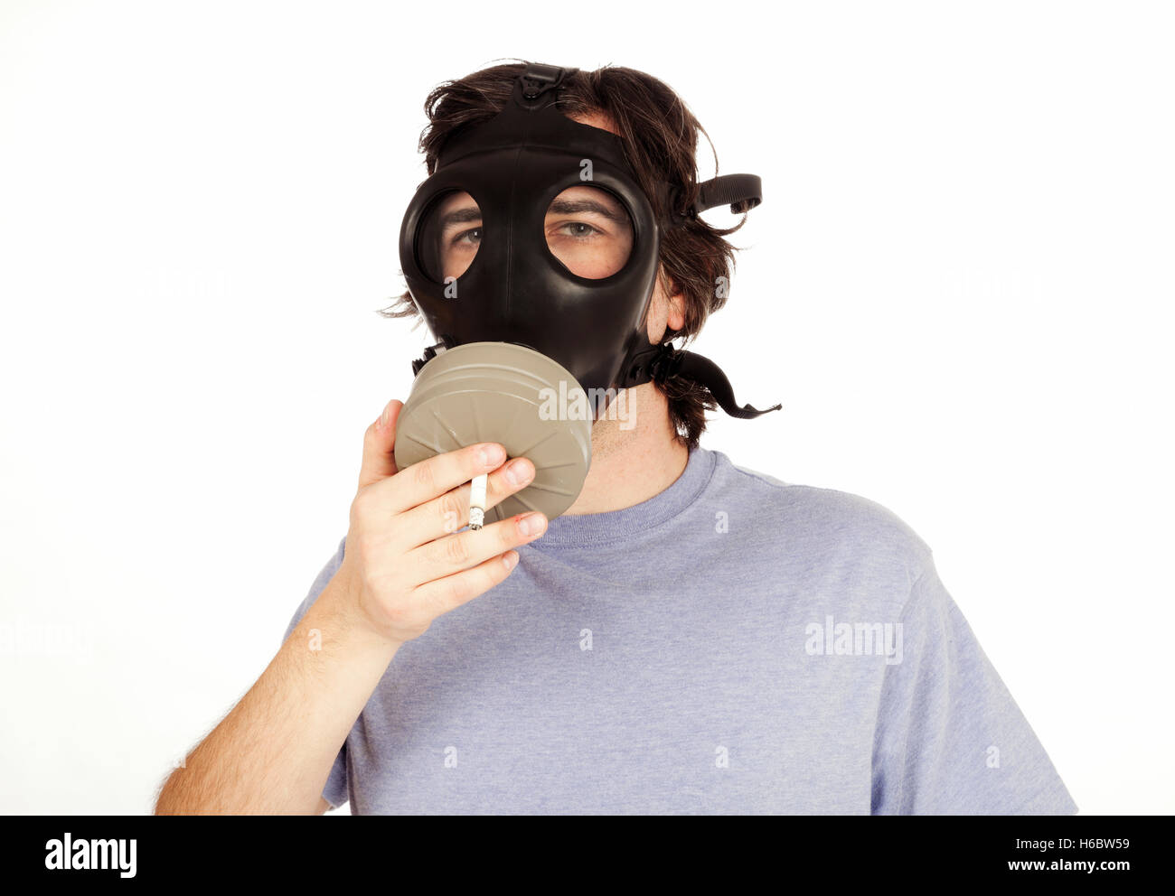 Man with face mask smoking cigarette hi-res stock photography and ...