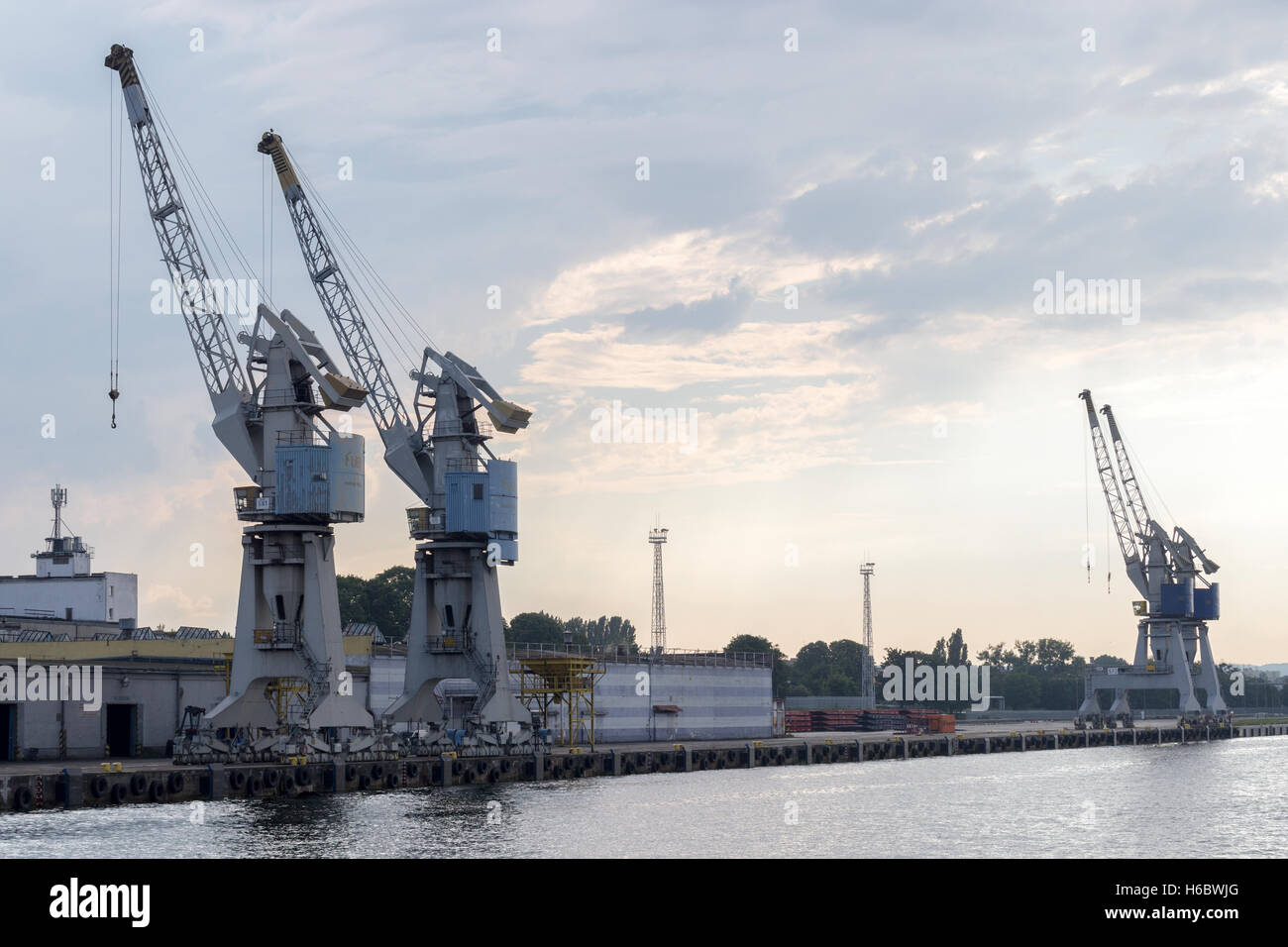 Industry, Top-slewing luffing-jib tower cranes in shipyard operation ...