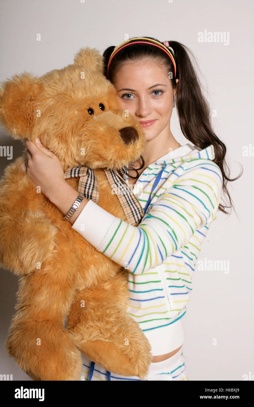 Young woman embraces fluffy hi-res stock photography and images - Alamy