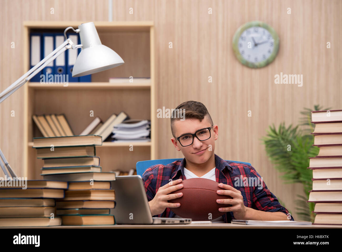 Young student preferring playing baseball to studying Stock Photo - Alamy