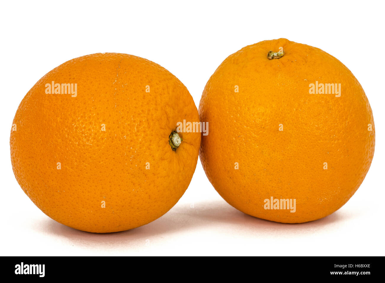 Two orange fruit, isolated on white background Stock Photo - Alamy
