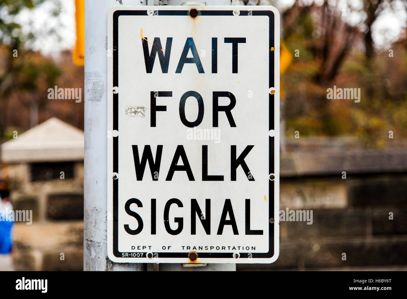 Traffic sign for pedestrians saying "Wait for walk signal Stock Photo ...