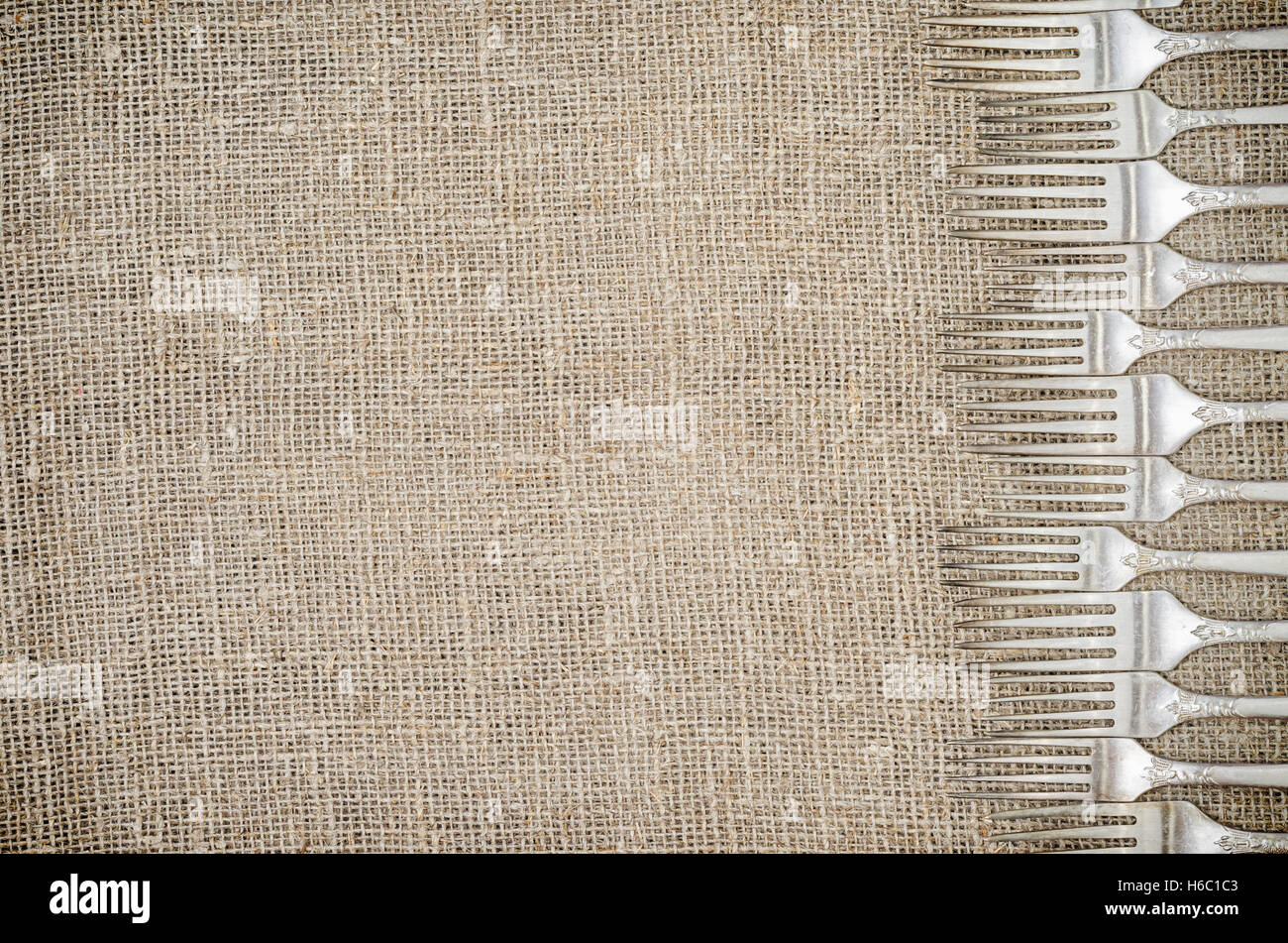 Rustic linen background with vintage silver forks. Menu Stock Photo - Alamy