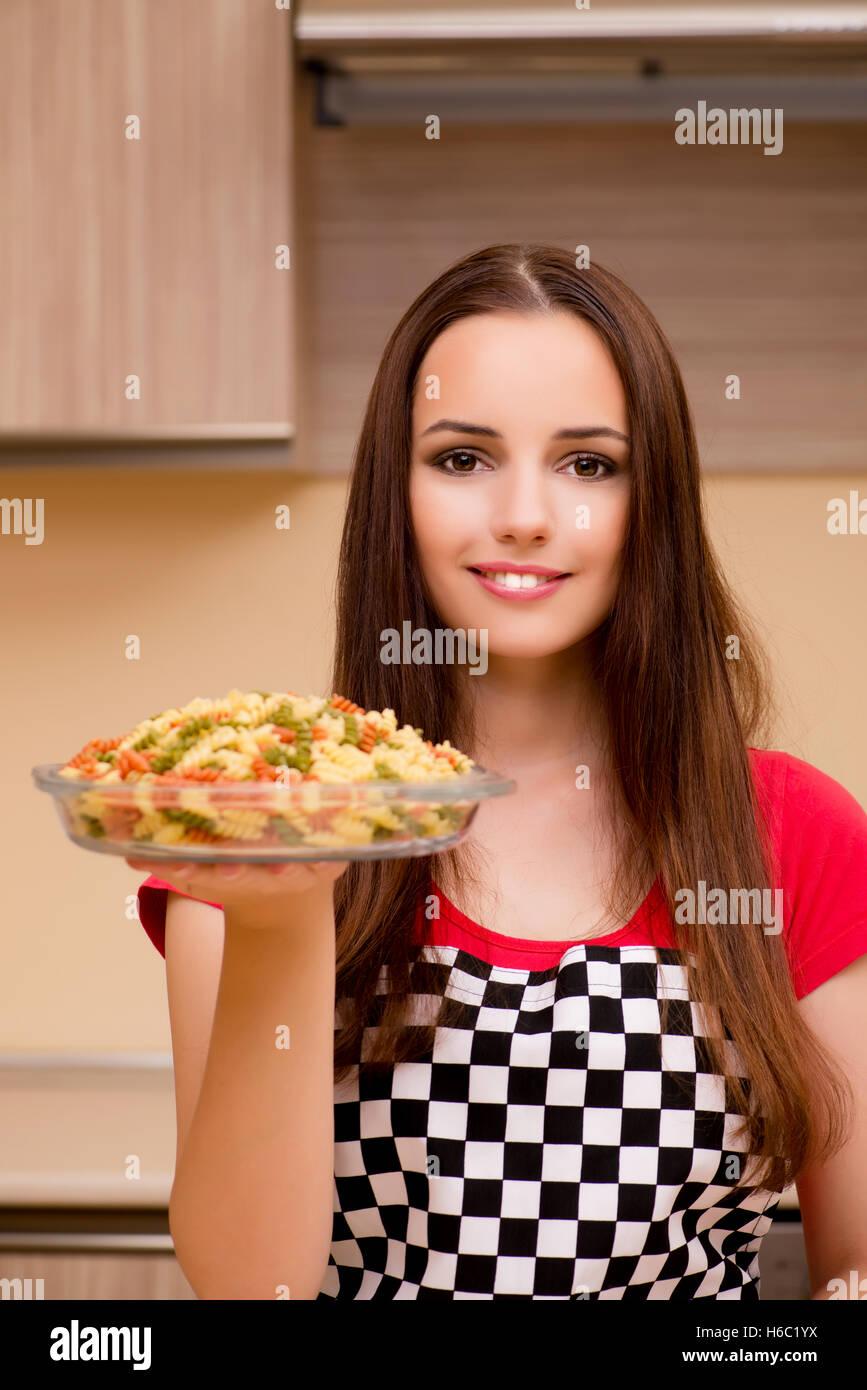 Young woman housewife working in the kitchen Stock Photo - Alamy