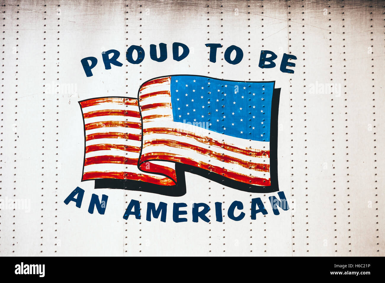 Drawing of the USA flag on white metal surface with the text "Proud to ...