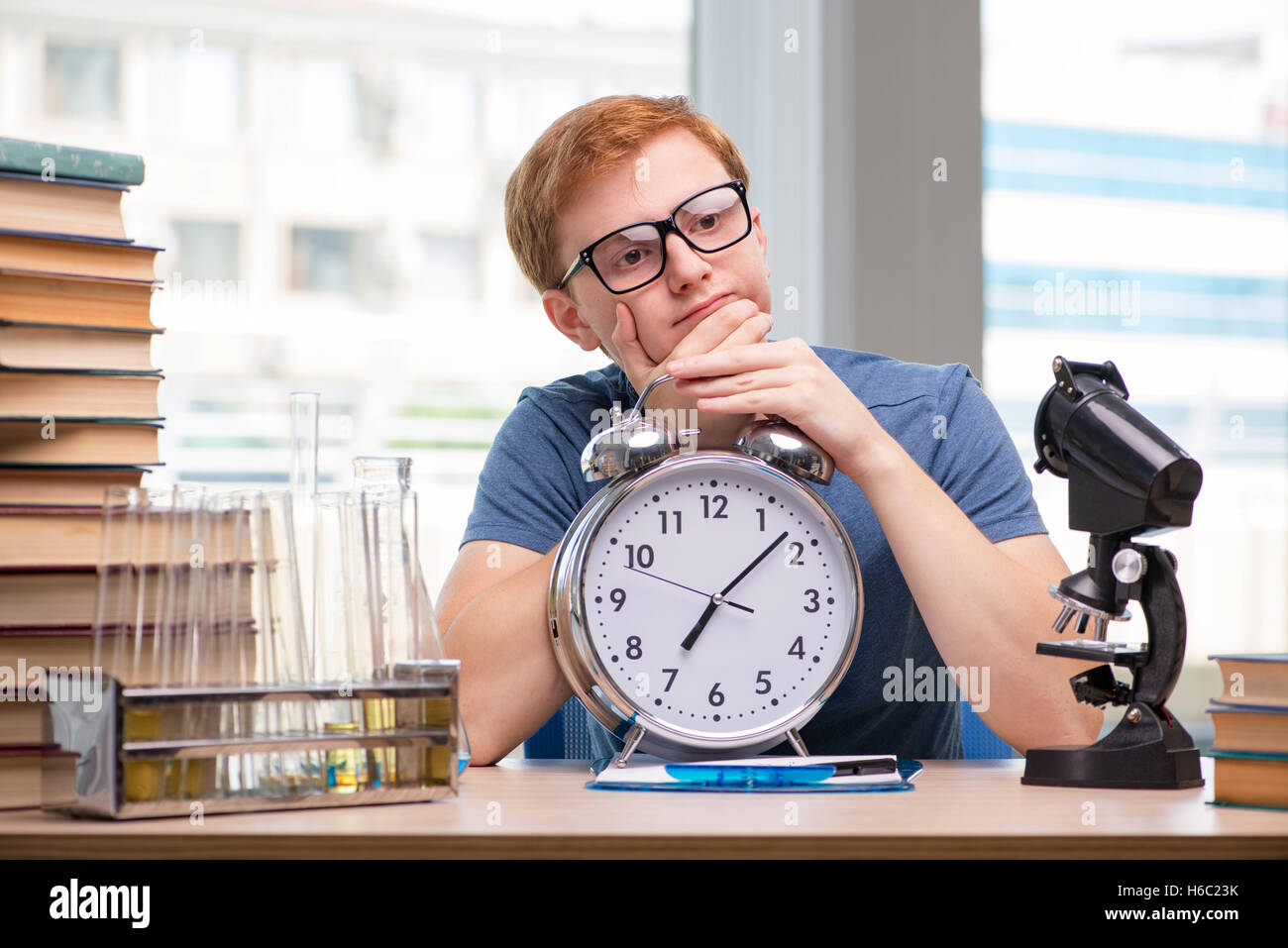 Young student preparing for chemistry exam Stock Photo - Alamy